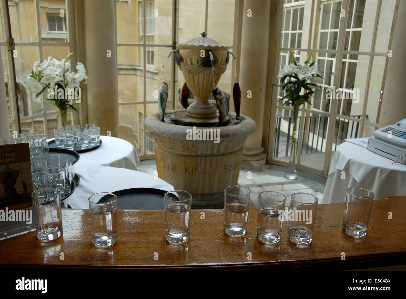 Spa water fountain, glasses, pump room, Bath, England, UK Stock Photo ...