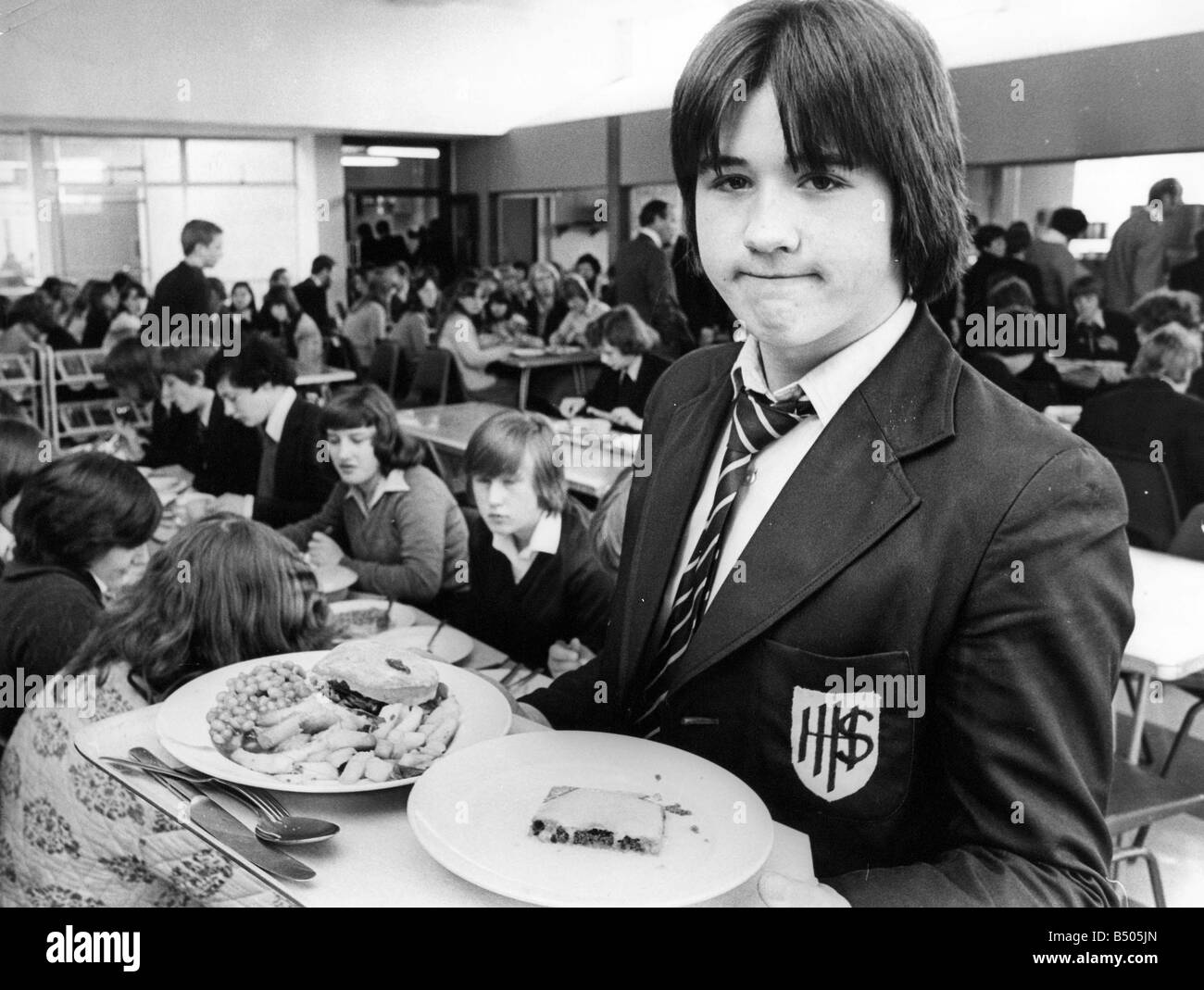 Ian Mullaney enjoys his school dinner in a crowded dining hall Stock ...