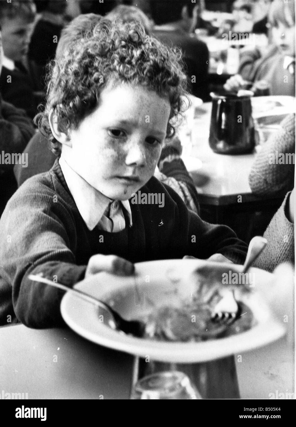 Please sir I want some more this little boy has enjoyed his school meal ...