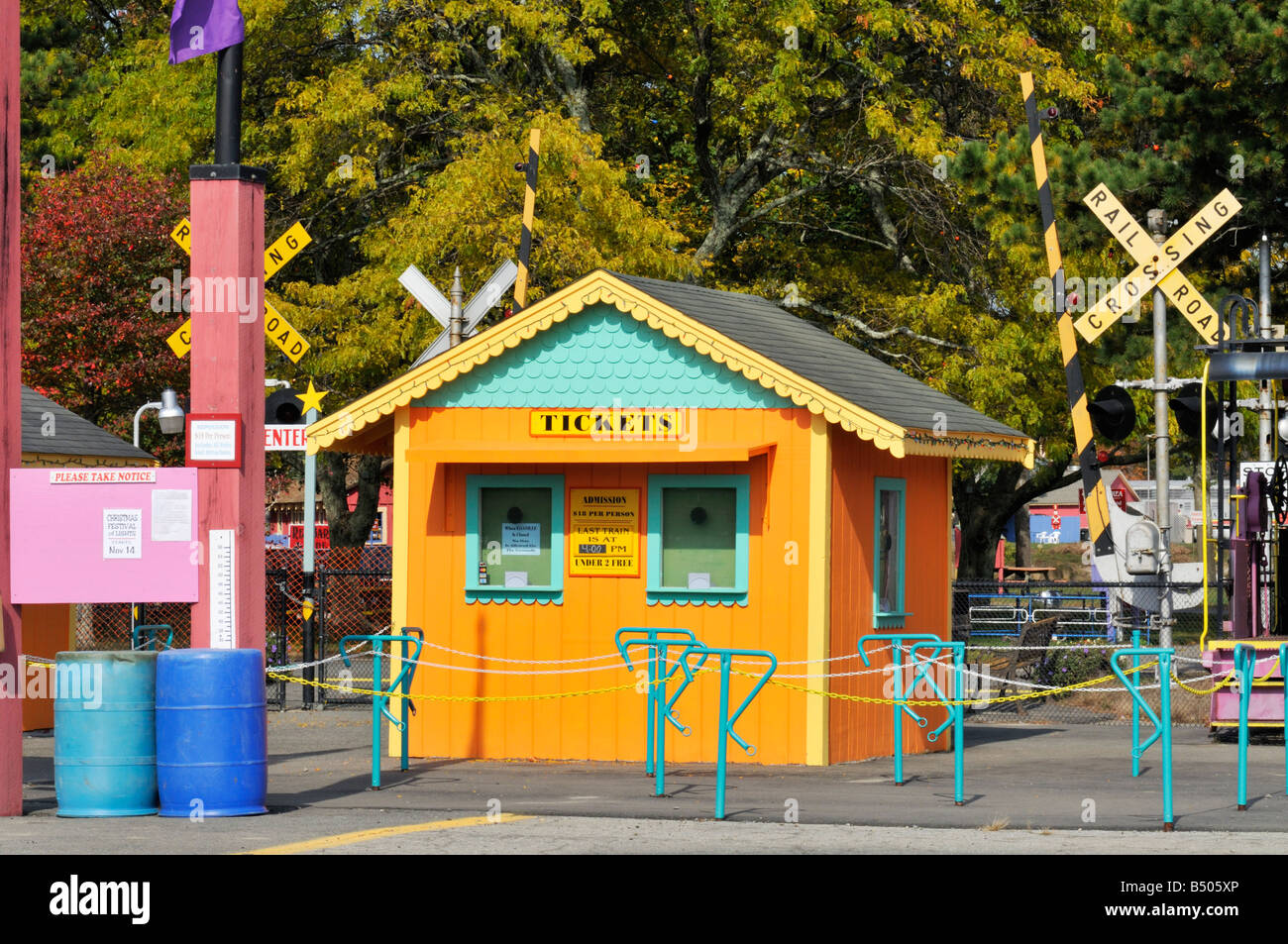 Bright orange ticket booth with railroad crossing signs at Edaville ...
