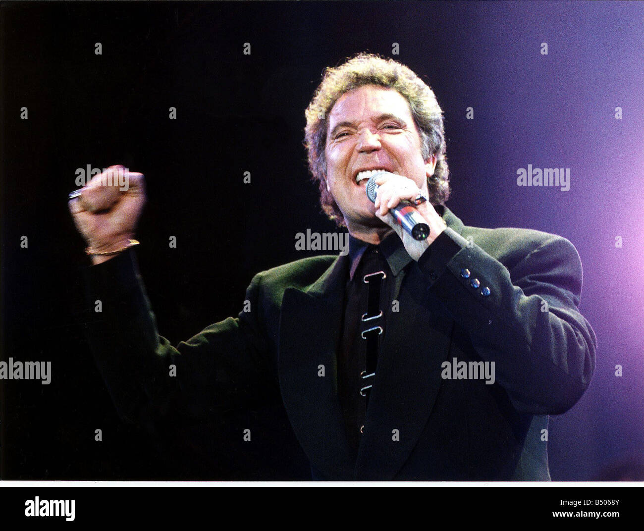 Tom Jones British Singer Singing at Simple Truth concert Holding ...