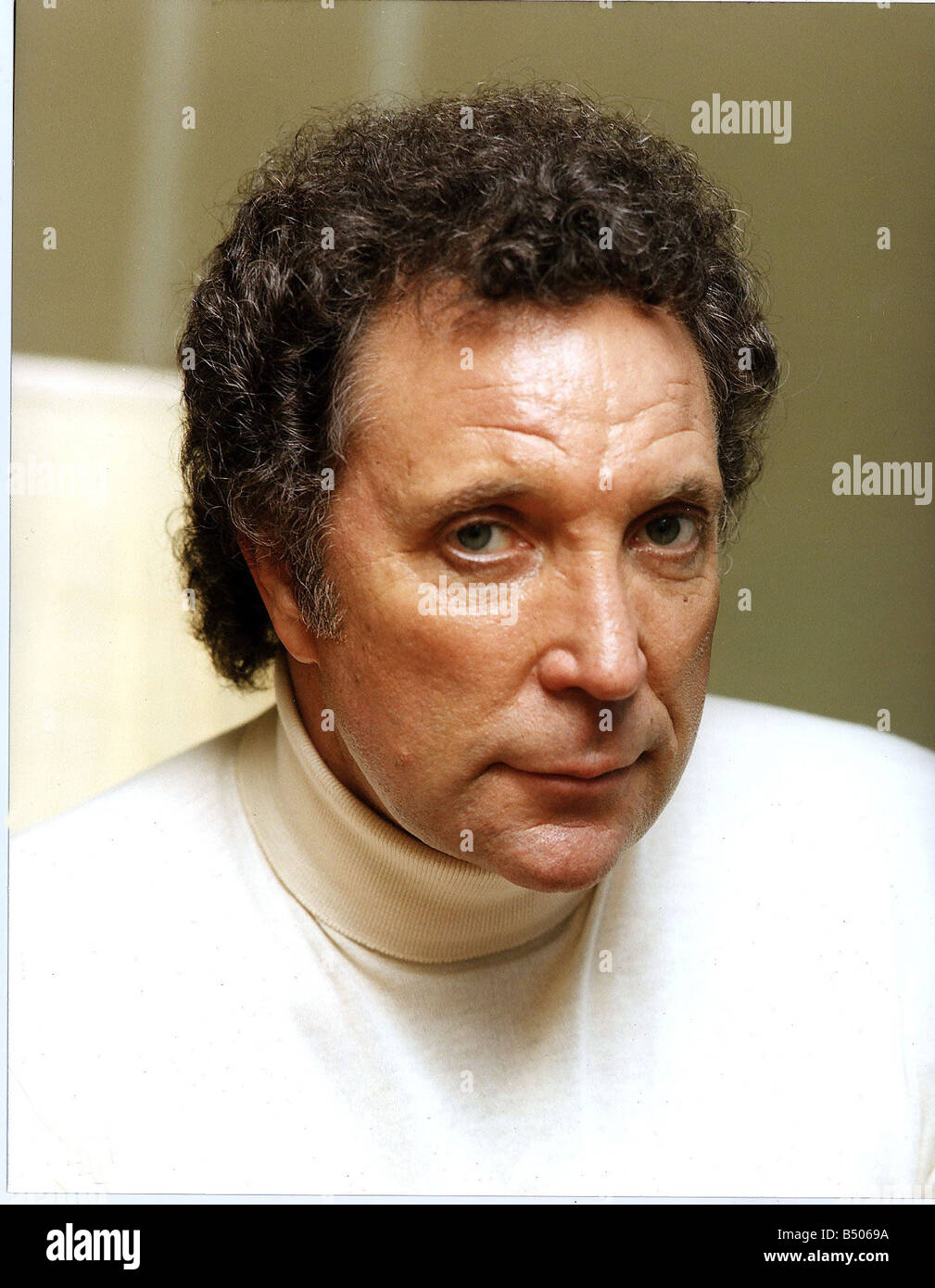 Tom Jones singer Wearing white polo neck Stock Photo - Alamy