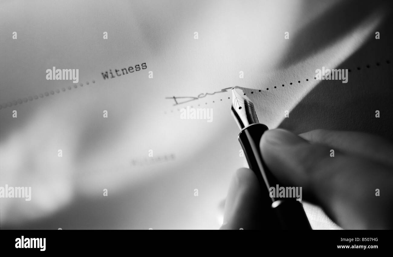 Hand and pen signing legal papers Stock Photo - Alamy