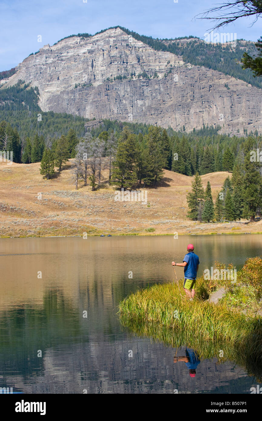 Montana, Yellowstone National Park. A man hikes on a beautiful fall day ...