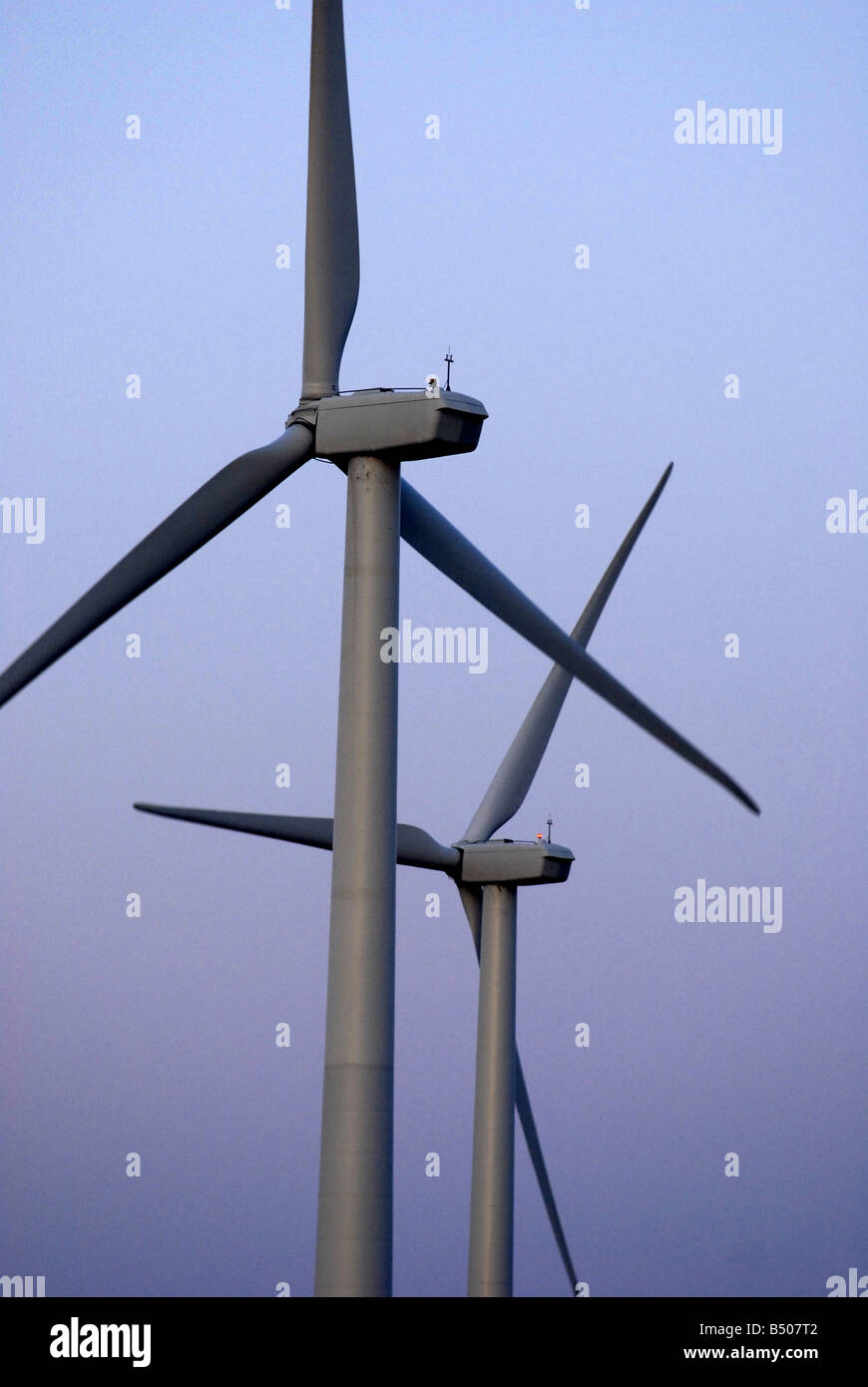 Three bladed wind turbines before sunrise at the Blue Canyon Wind Farm ...