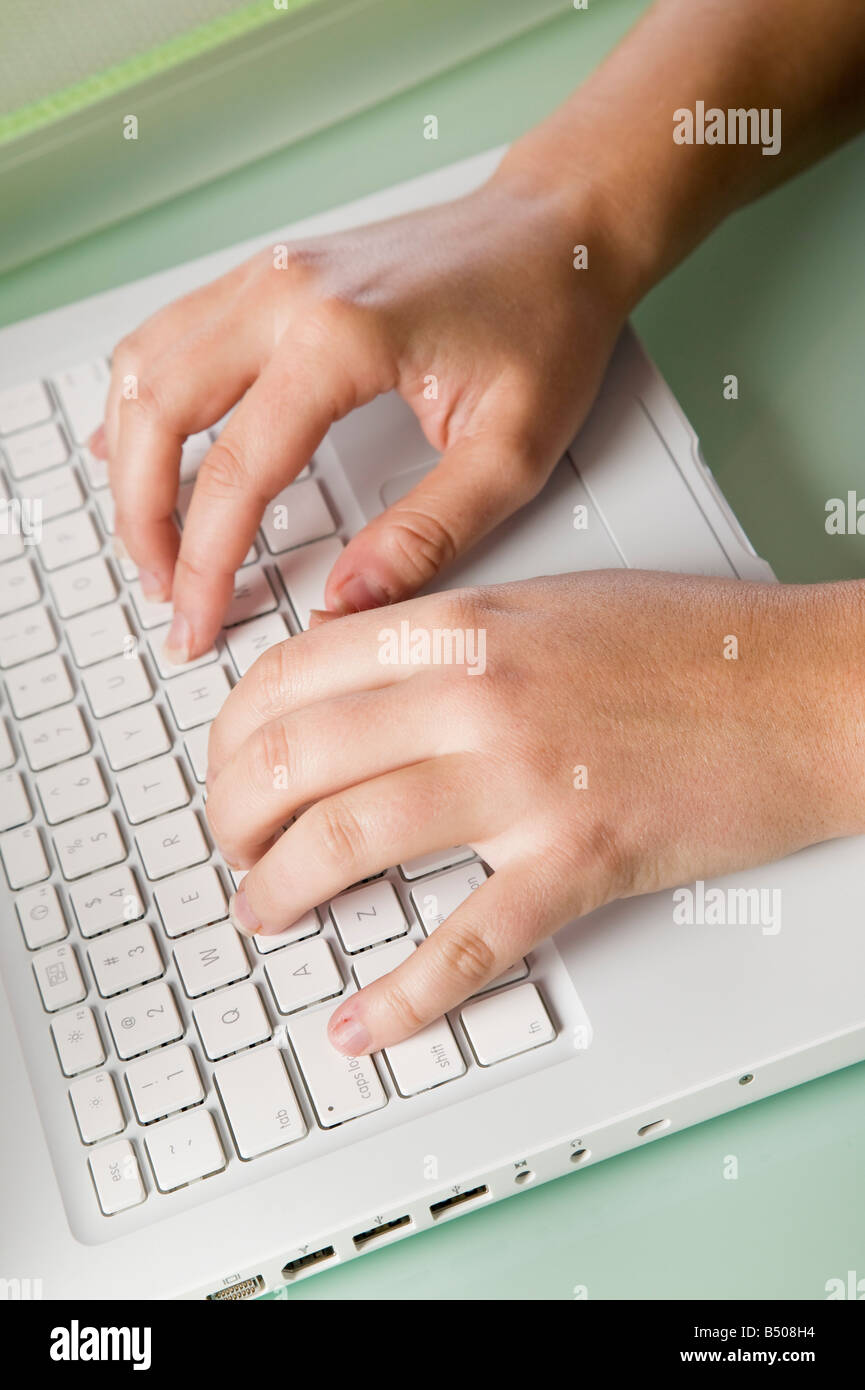 Close up womans hands and a laptop keyboard Stock Photo - Alamy