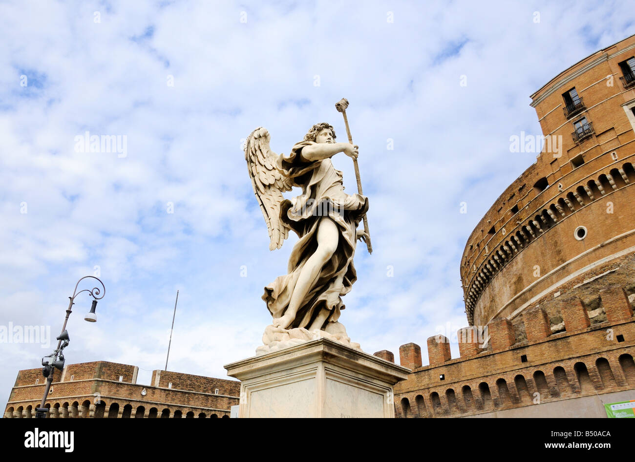 A marble Bernini angel on the Bridge of Angels with the Castel Sant ...