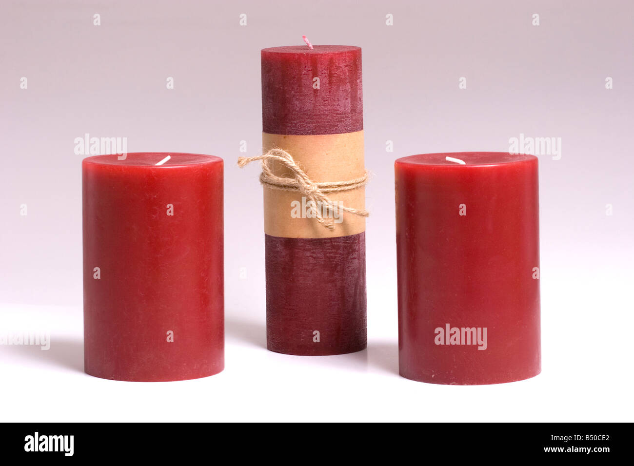 Three Red Candles on a white background Stock Photo - Alamy