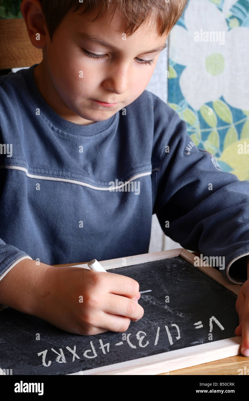 Young mathematician working on a blackboard Stock Photo - Alamy
