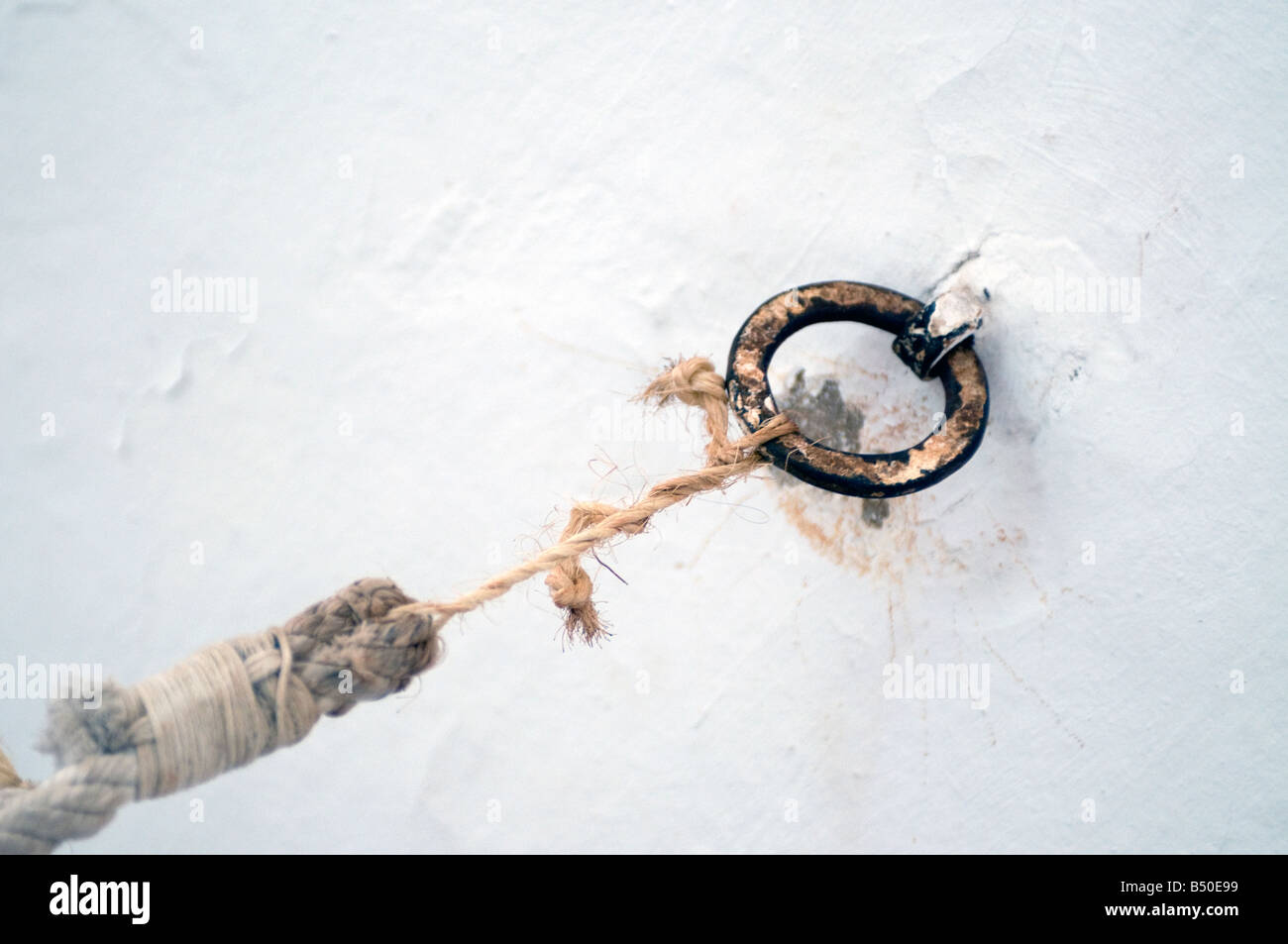 Hanging by a thread Stock Photo - Alamy