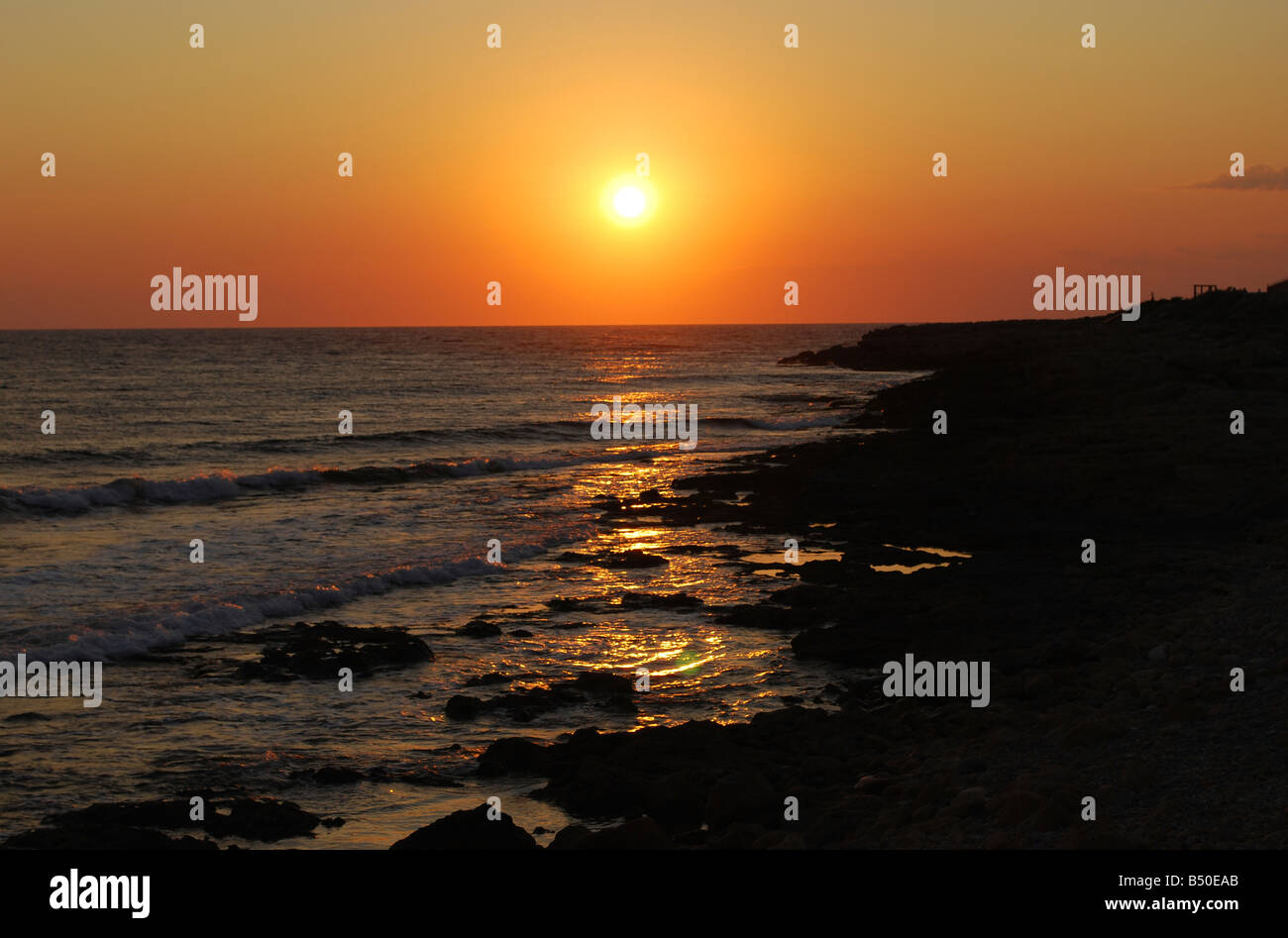 Sunset on the Mediterranean Sea seen from the sea shore at Paphos ...