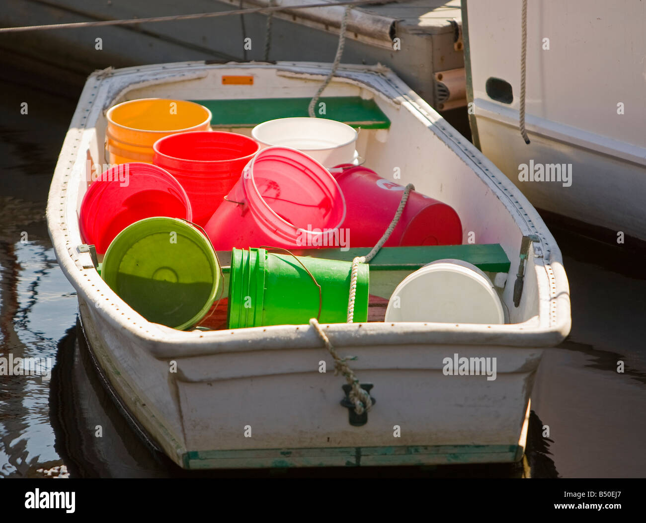 Rowboat filled with buckets Stock Photo - Alamy