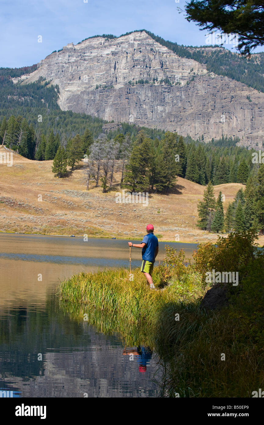 Montana, Yellowstone National Park. A man hikes on a beautiful fall day ...