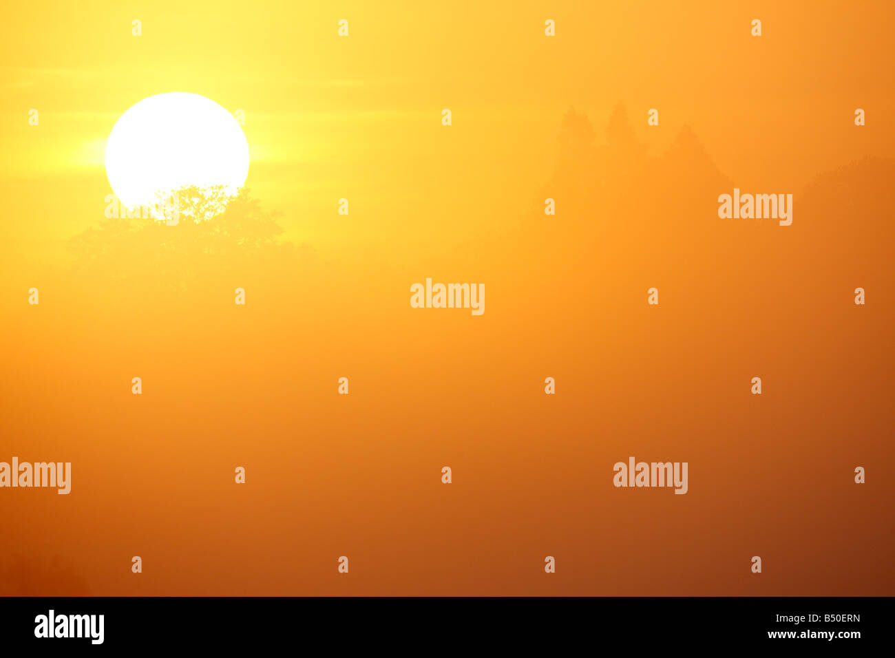 Sunrise through mist hi-res stock photography and images - Alamy