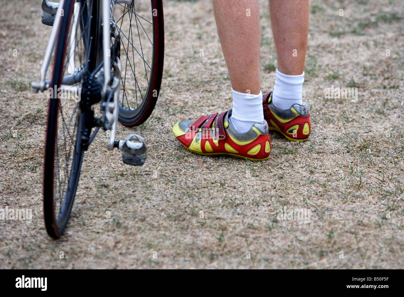 A cyclist's feet with a racing bike Stock Photo - Alamy