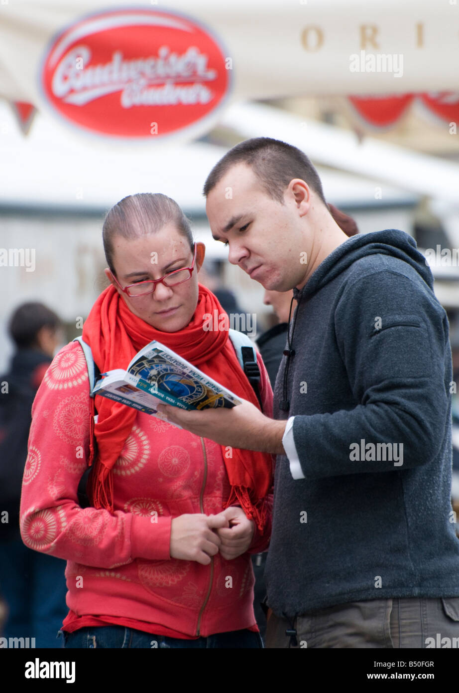 Two tourists looking at a guide book in Prague FOR EDITORIAL USE ONLY ...