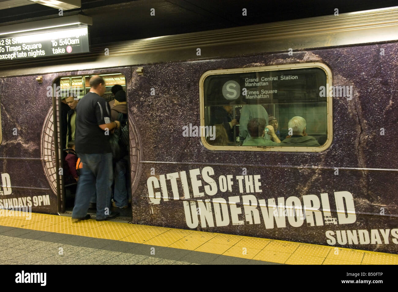 A Times Square shuttle in New York is wrapped in advertising as a ...
