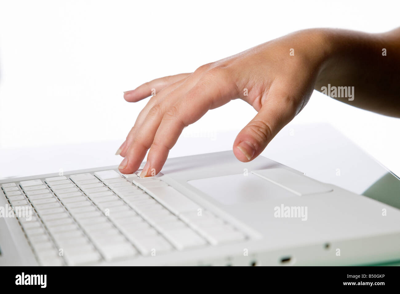 Close up womans hand and a laptop keyboard Stock Photo - Alamy