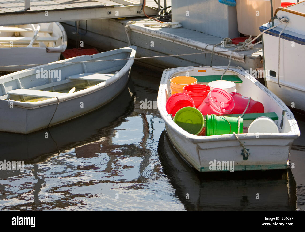 Rowboat filled with buckets Stock Photo - Alamy