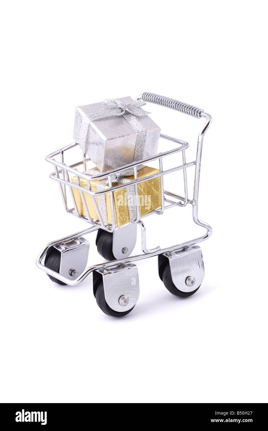 Gift boxes in a mini shopping cart on white background Stock Photo - Alamy