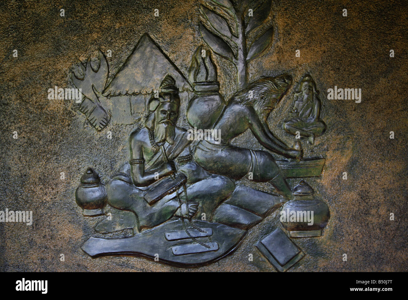 Sculpture depicting Indian saints making ayurvedic medicine Stock Photo ...
