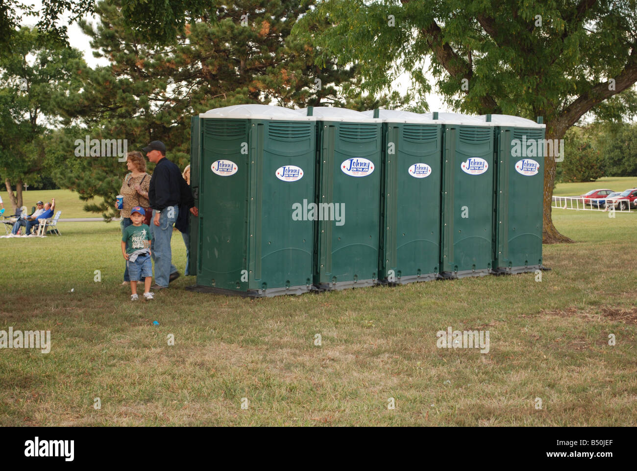 outdoor toilets row green portable potties Stock Photo - Alamy