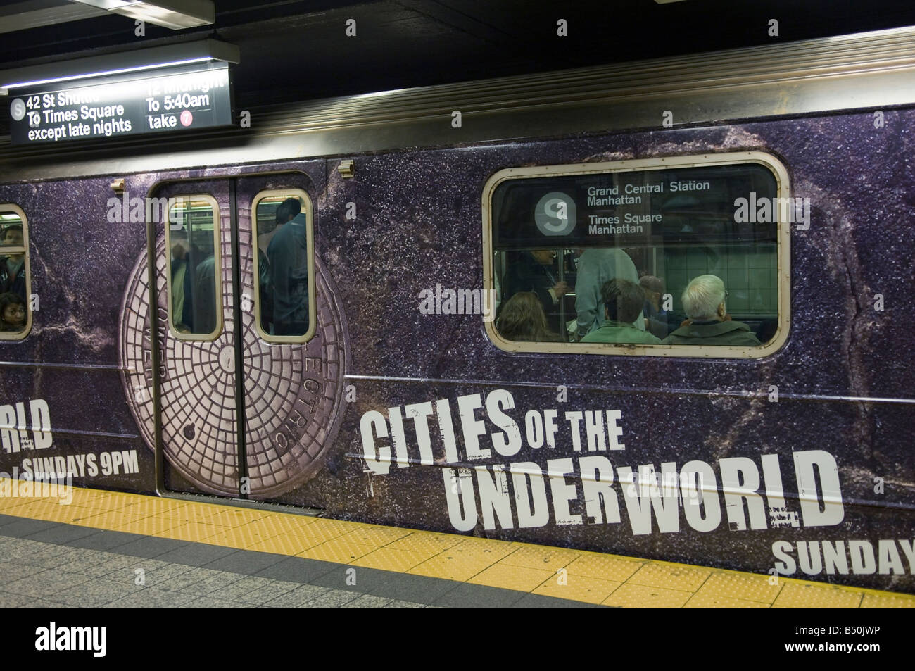 A Times Square shuttle in New York is wrapped in advertising as a ...