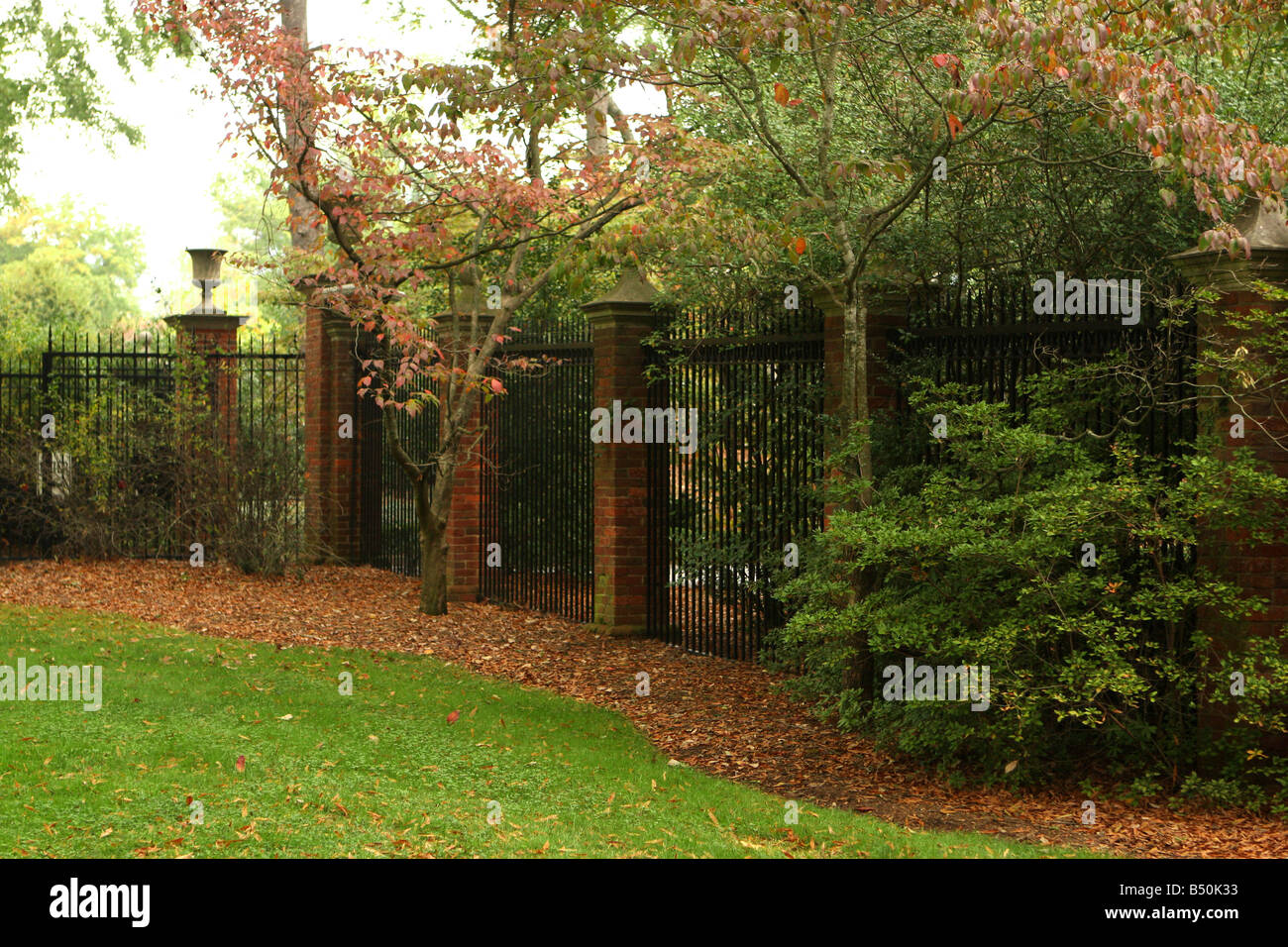 A wrought iron gate in the Fall Stock Photo - Alamy