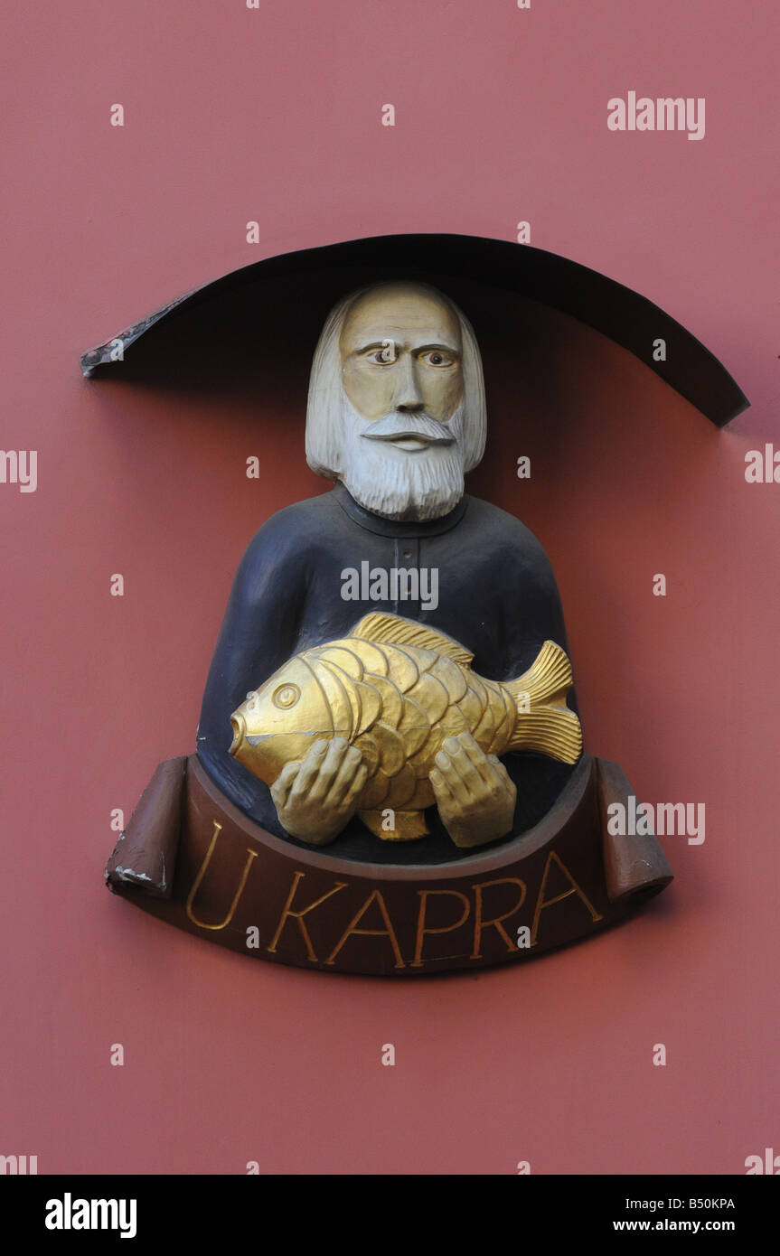 U Kapra - The Golden Carp sign on a building in Prague, Czech Republic ...