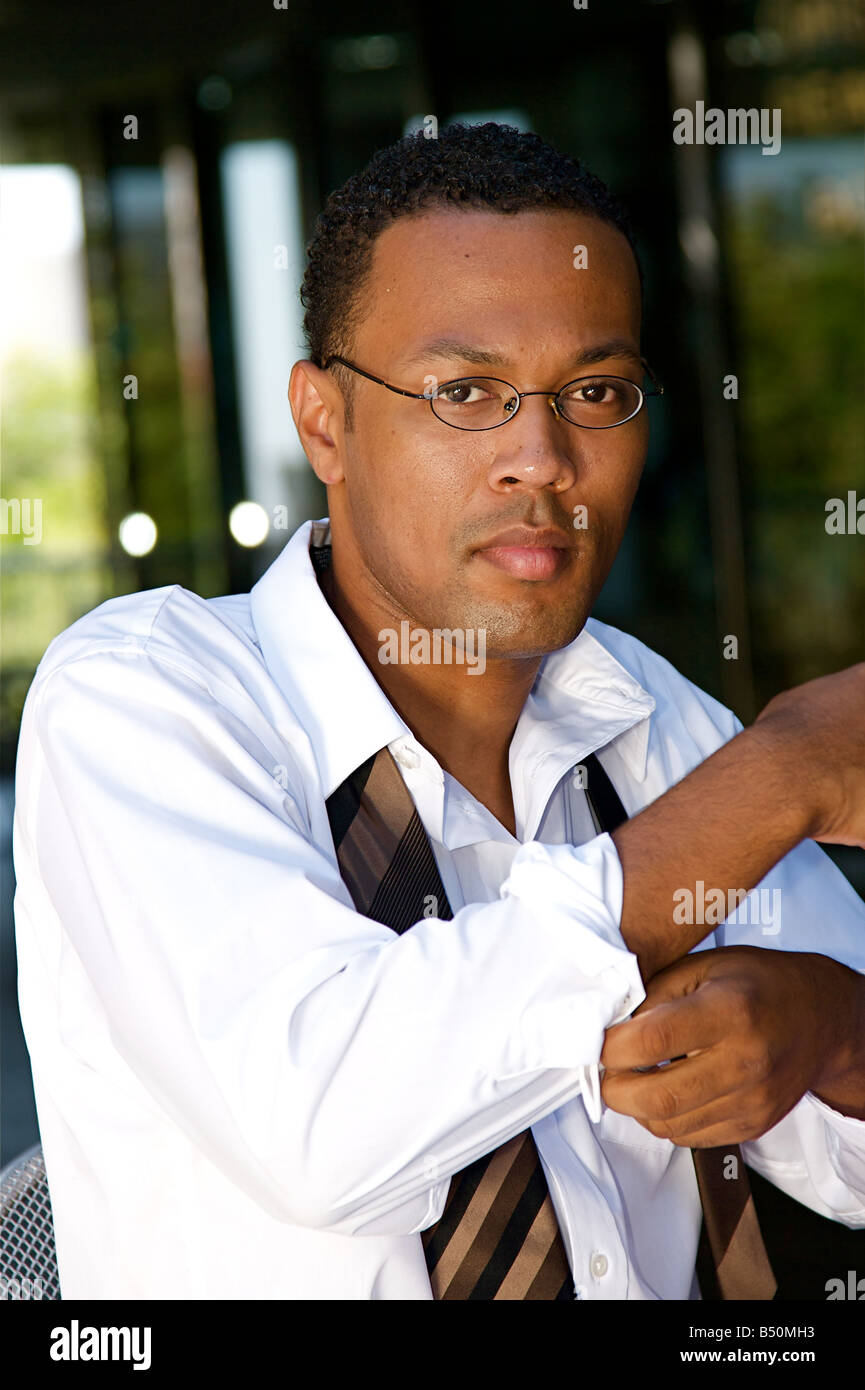 An confident and successful African American businessman in a power ...
