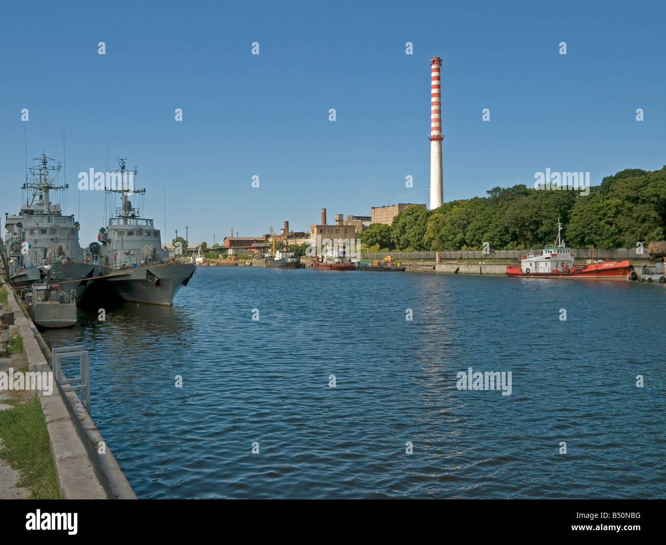 two old military ships at wharf and trading port at Baltic Sea at town ...
