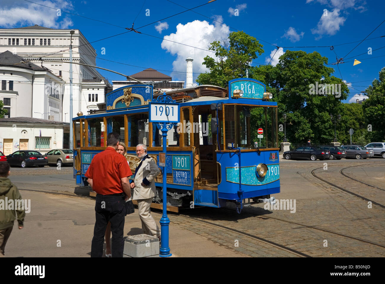 Tourists getting on the sightseeing tram in Riga Stock Photo - Alamy