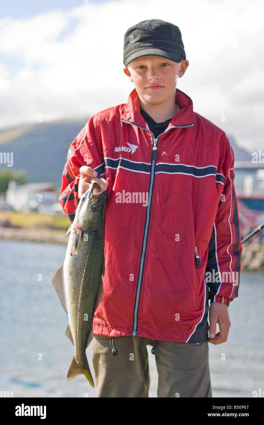 Portrait of a boy with fish during Fiskidagurinn mikli -Great Fish Day ...