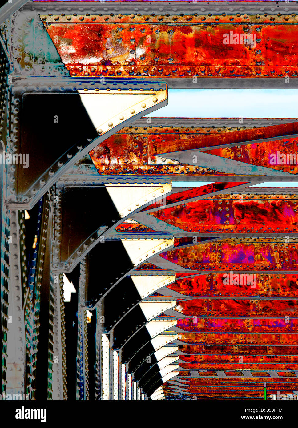 Abstract design false colour shot of a rusty girder bridge in ...