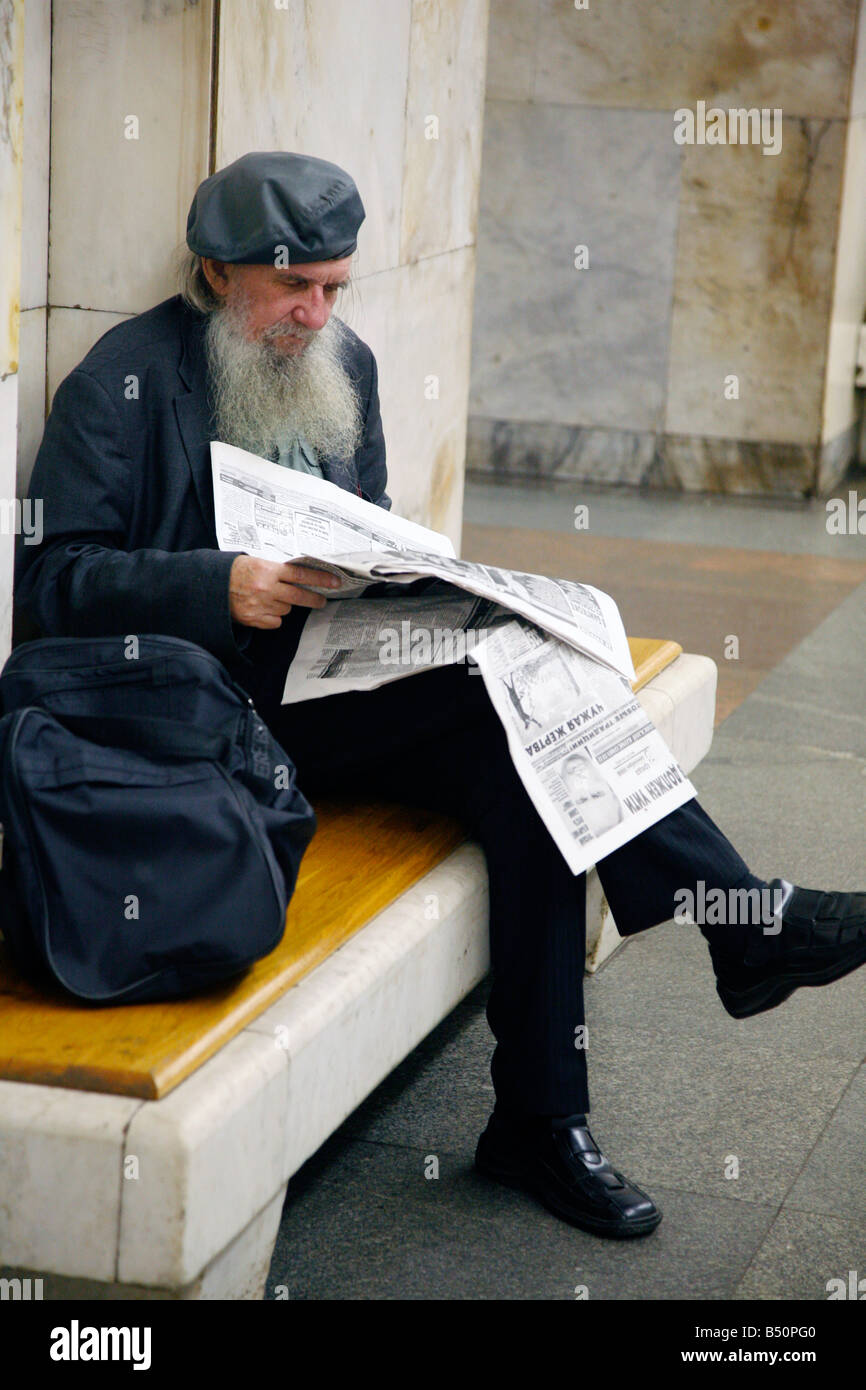 Sep 2008 - Man reading newspaper at the Metro station Moscow Russia ...
