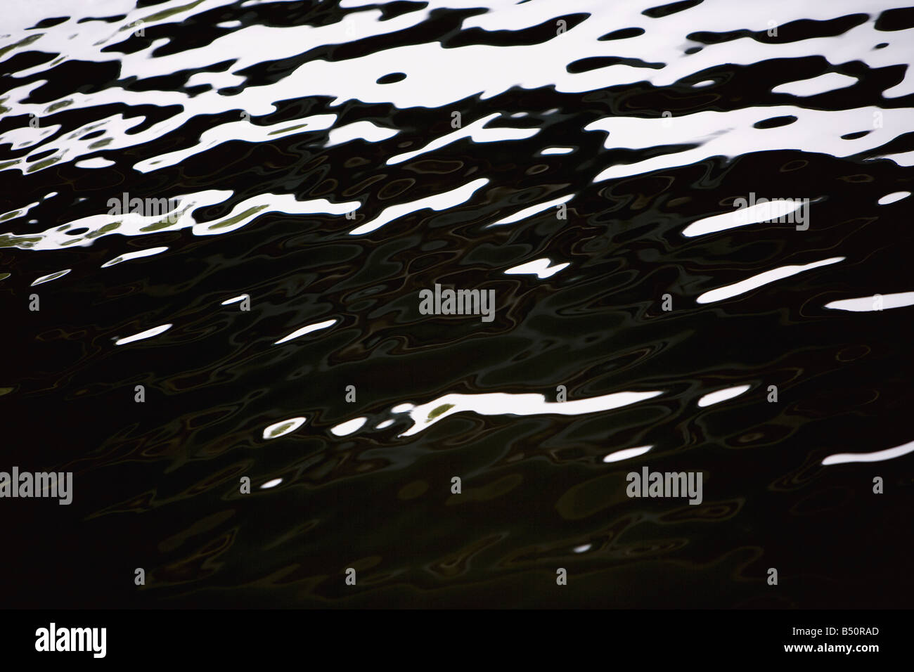 Ripples in dark water Stock Photo - Alamy