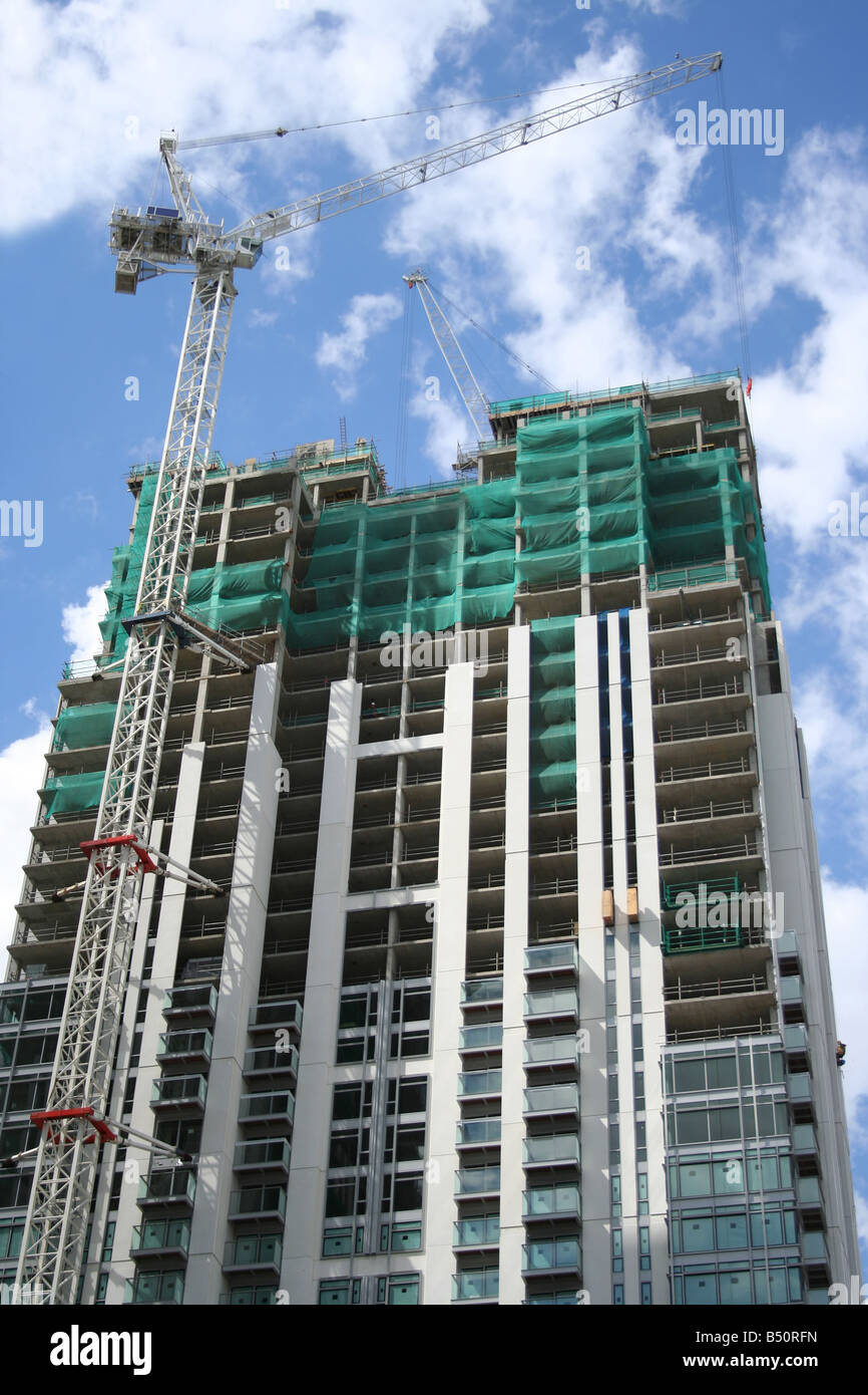 crane and unfinished building at construction site Stock Photo - Alamy