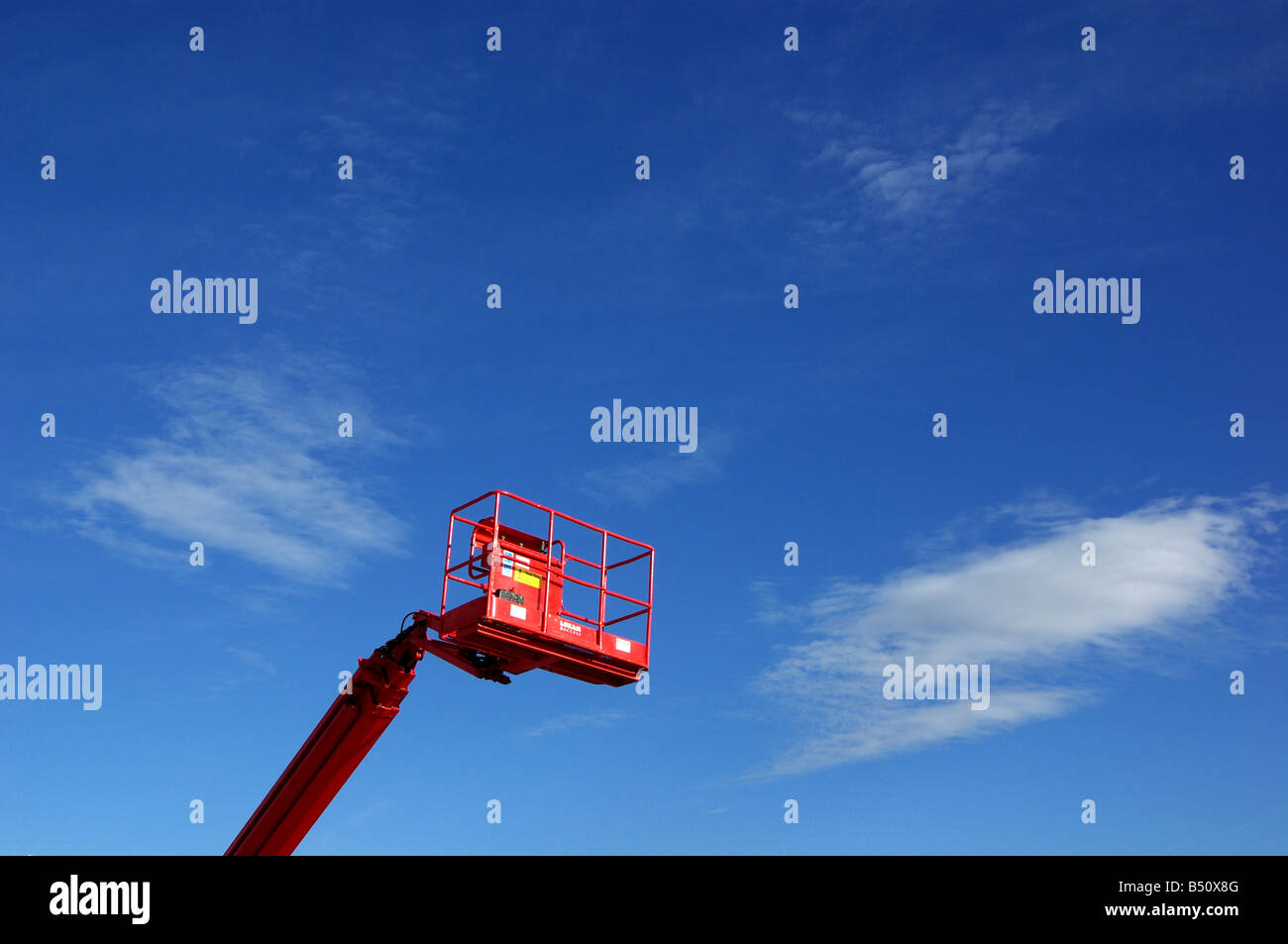 Cherry picker against blue sky Stock Photo - Alamy