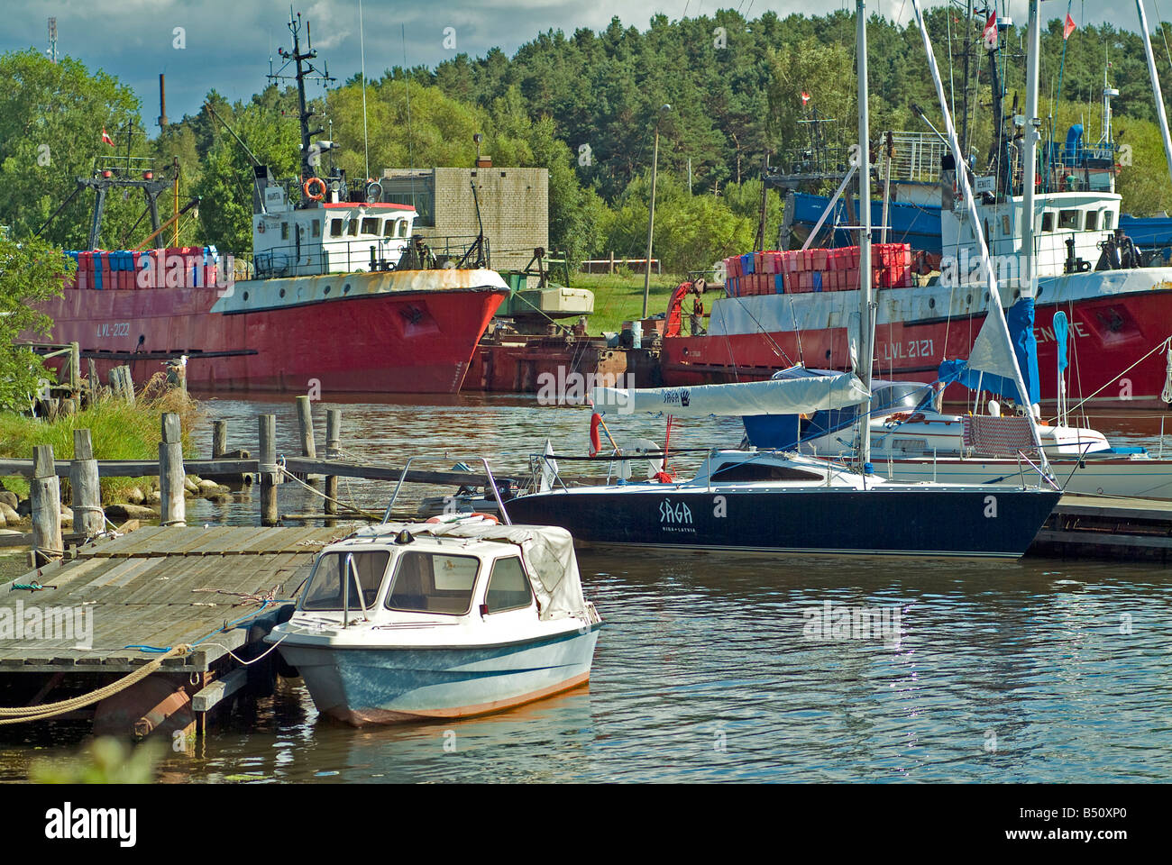 wharf and old port ships and boats at Baltic Sea in Pavilosta Latvia ...