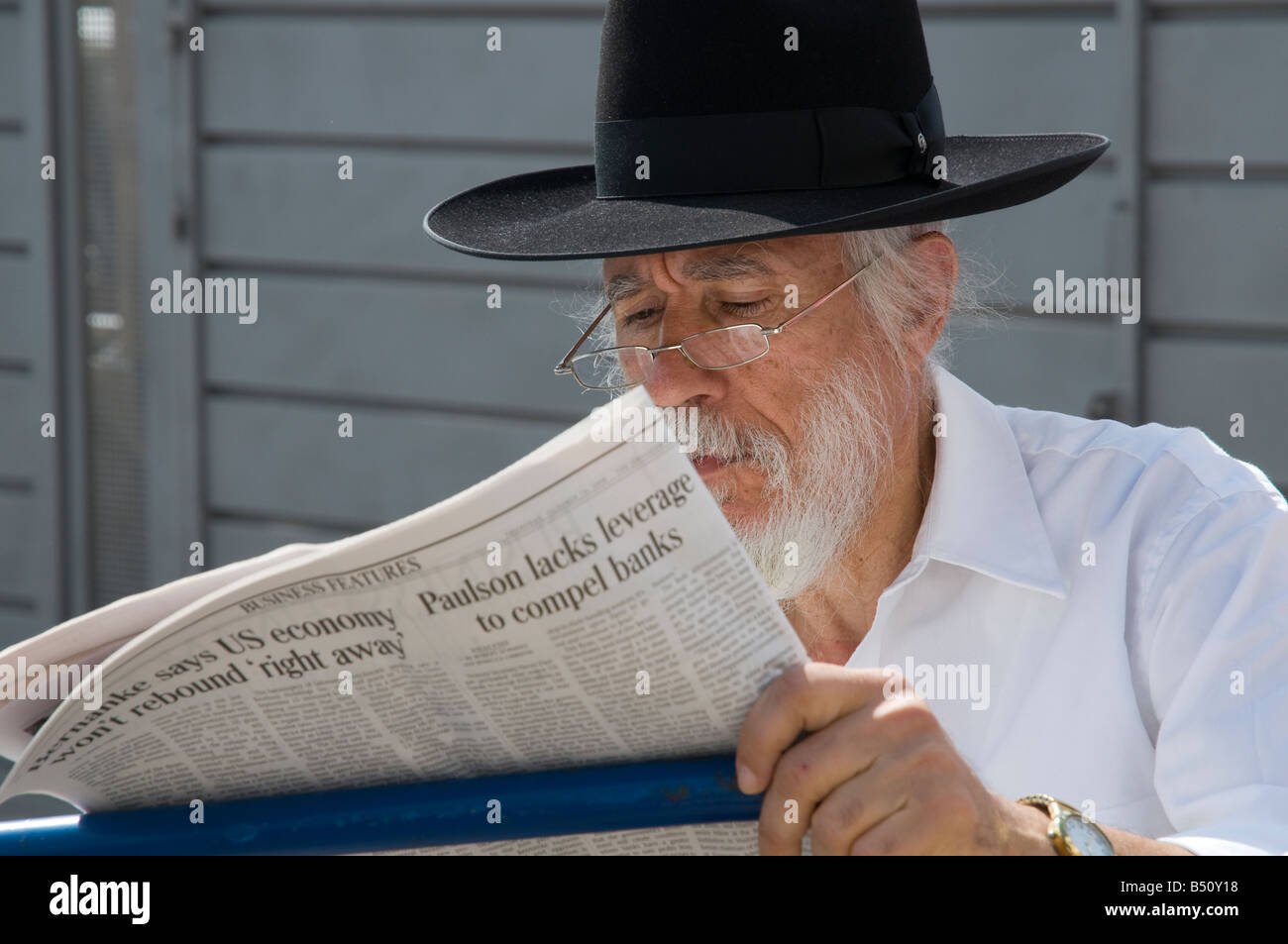 Israel Jerusalem Western Wall orthodox jew reading financial newspaper ...