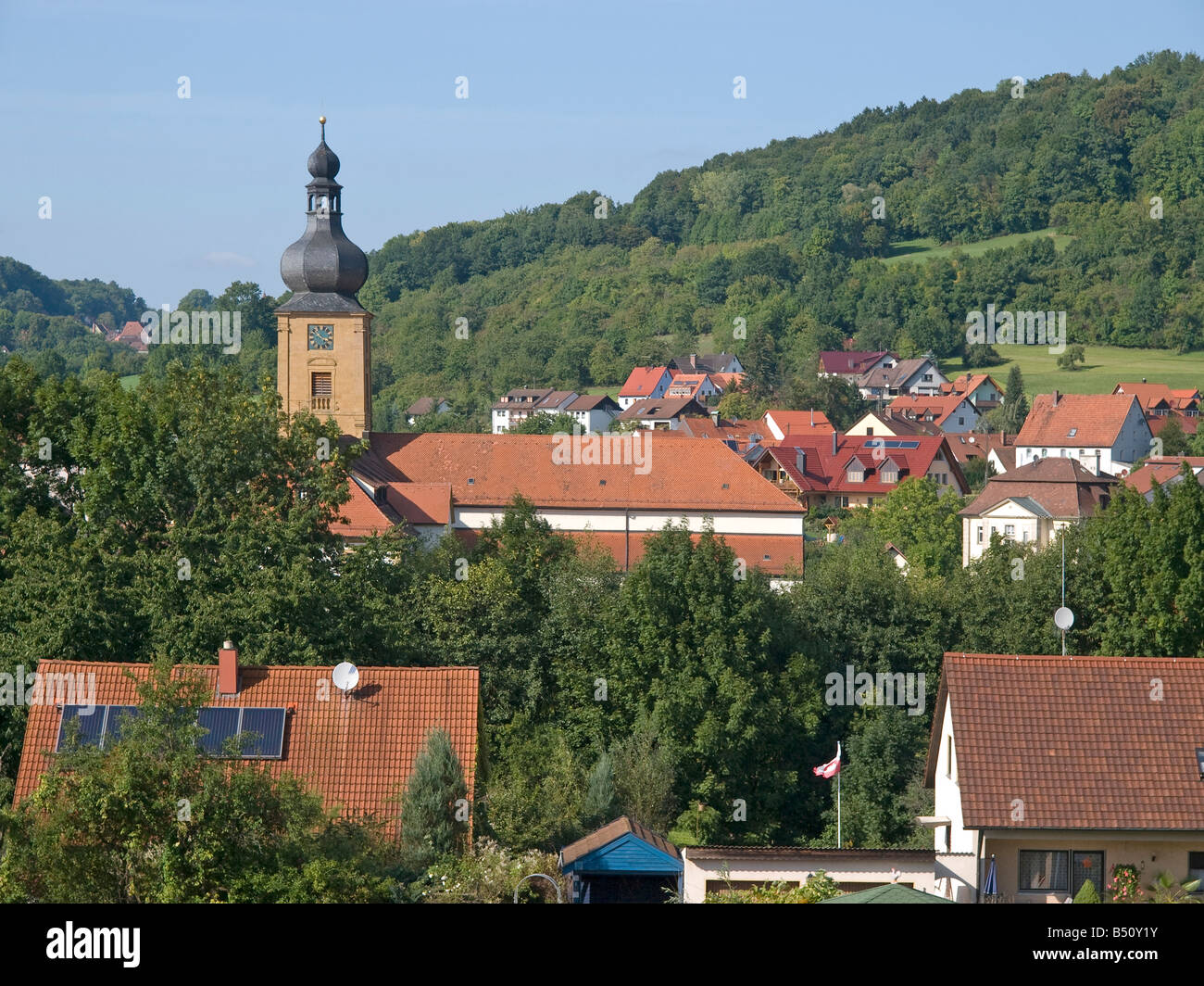monastery beer brewery village in the green landscape trees mountains ...