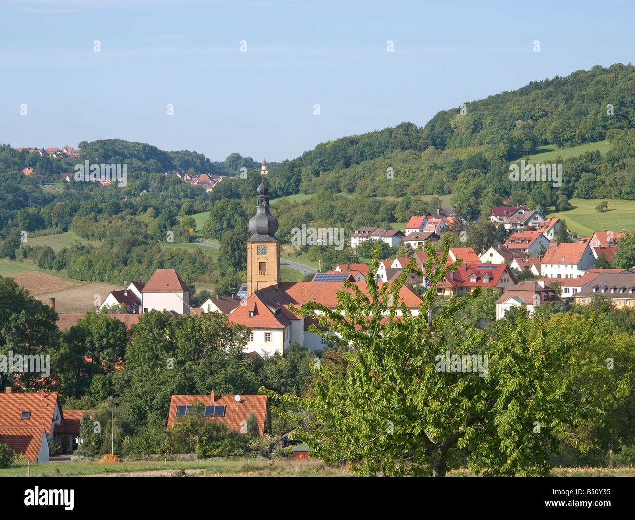 monastery beer brewery village in the green landscape trees mountains ...