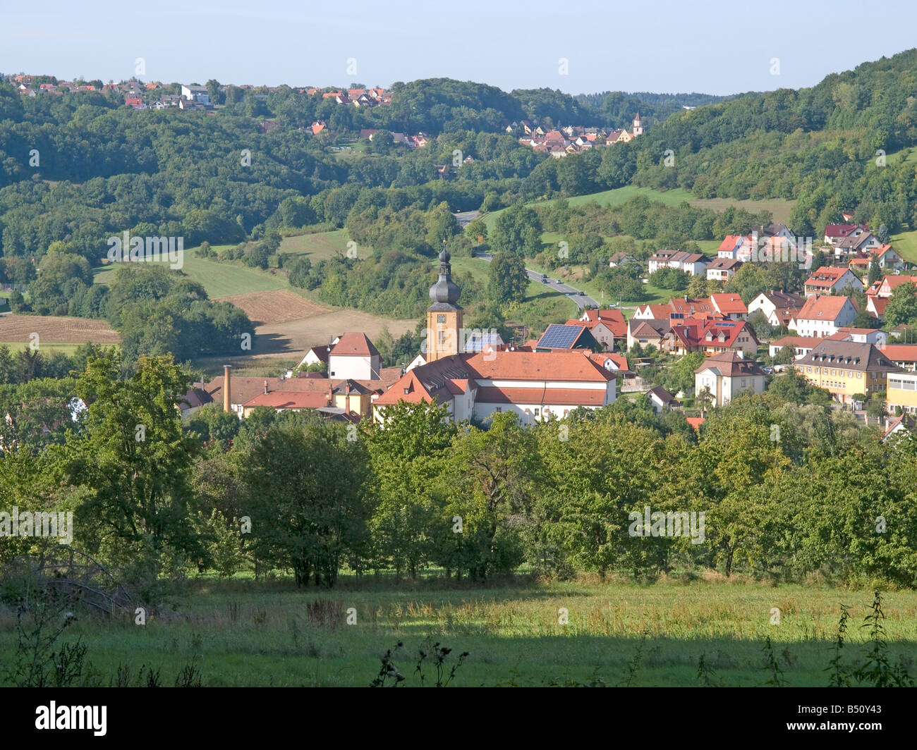 monastery beer brewery village in the green landscape trees mountains ...