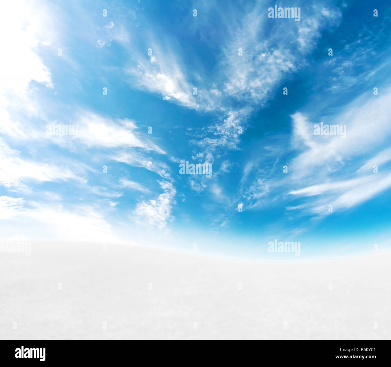 A simple tranquil beautiful S curved horizon with blue sky and snowy ...