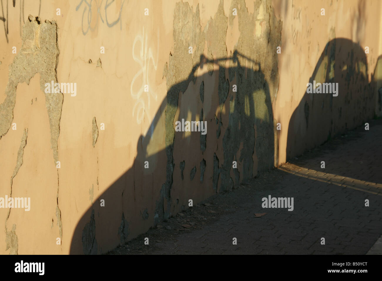 two cars shadow on wall in city Stock Photo - Alamy