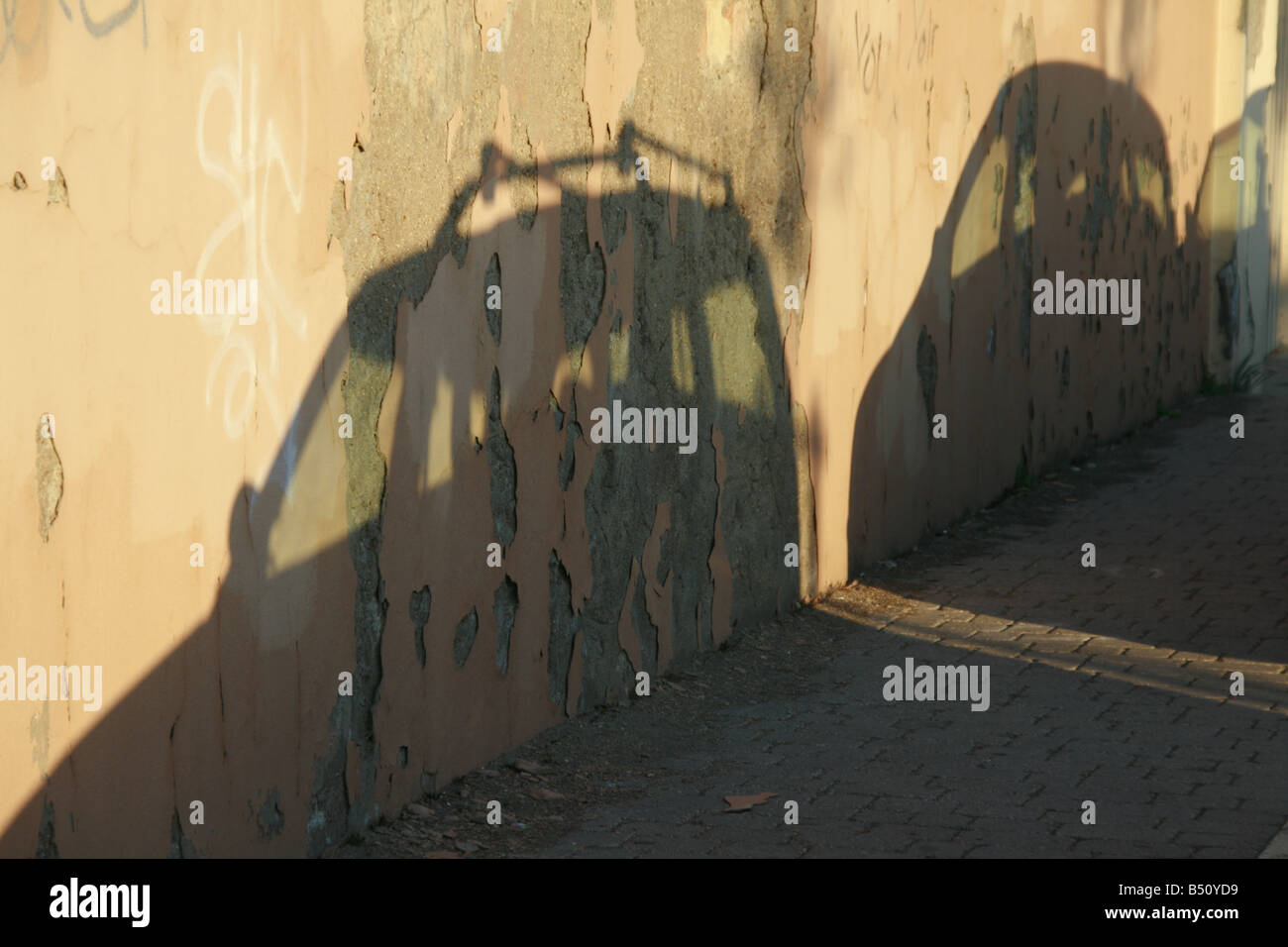 two cars shadow on wall in city Stock Photo - Alamy