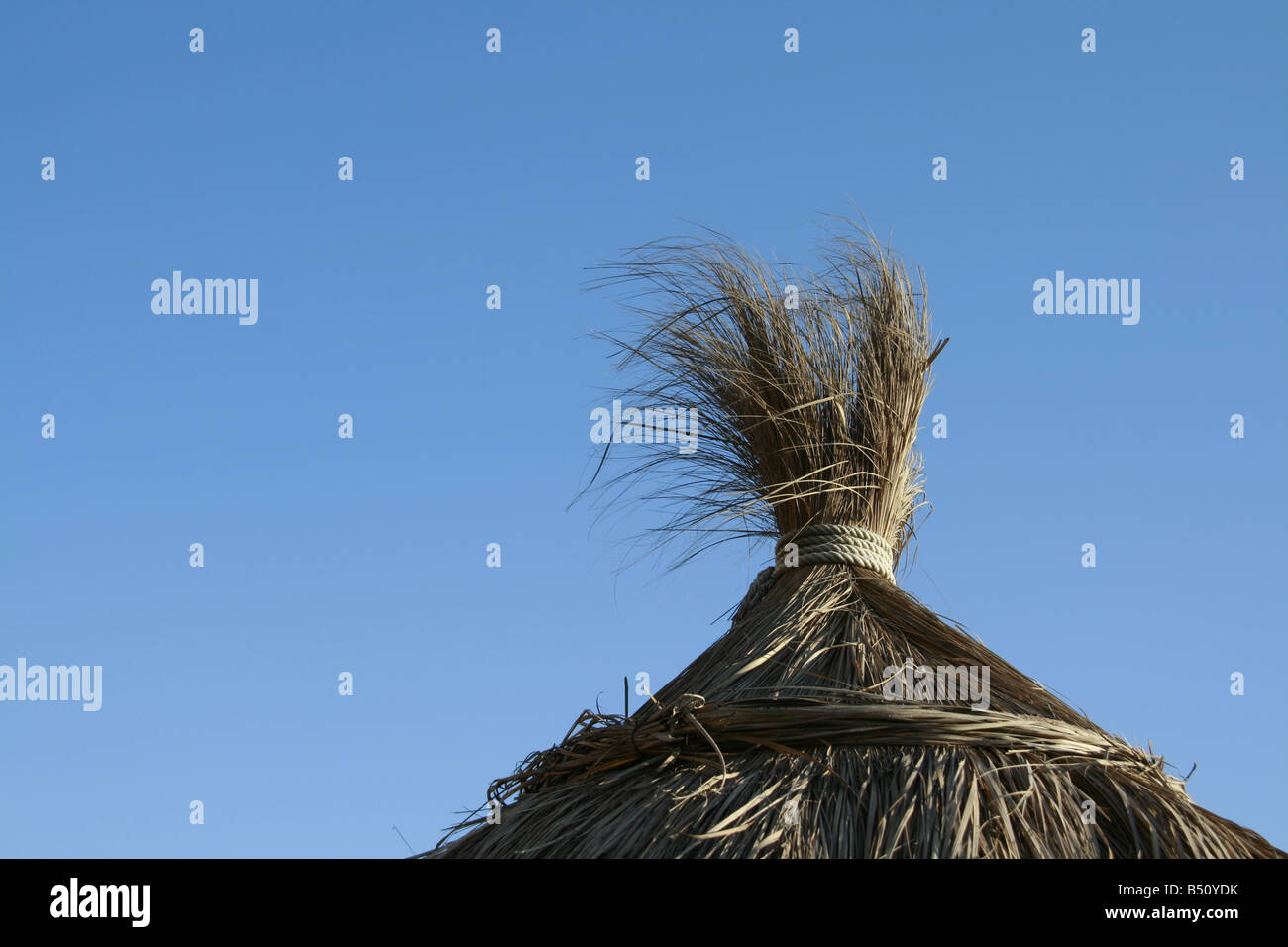 straw beach hut roof and blue sky in sun outdoors Stock Photo - Alamy