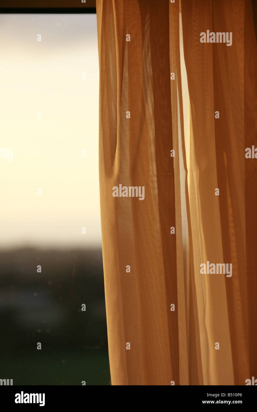 yellow window and curtains in room with sun light Stock Photo - Alamy