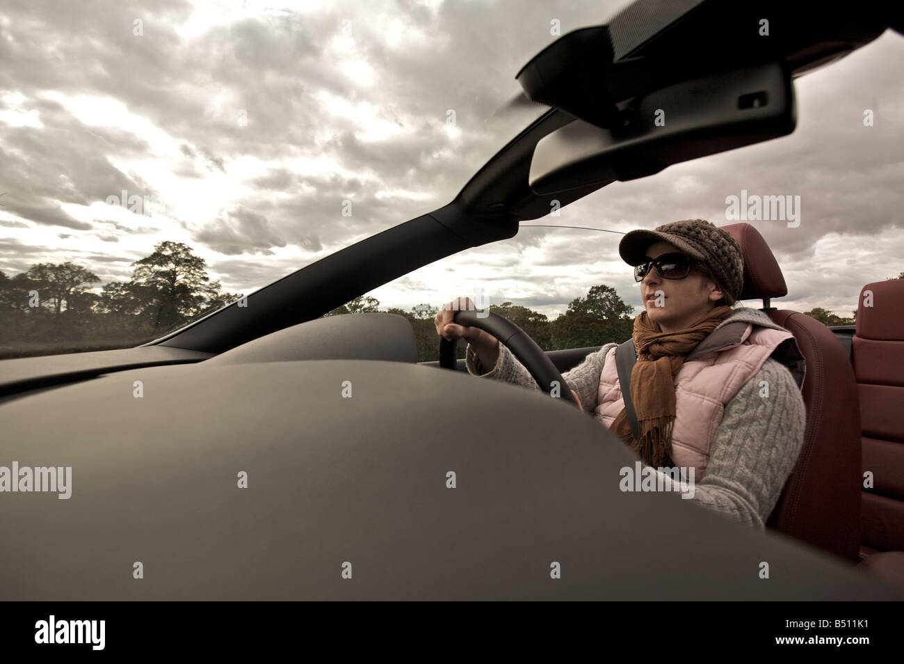 Lady driving convertible car with top down enjoying the weather Stock ...