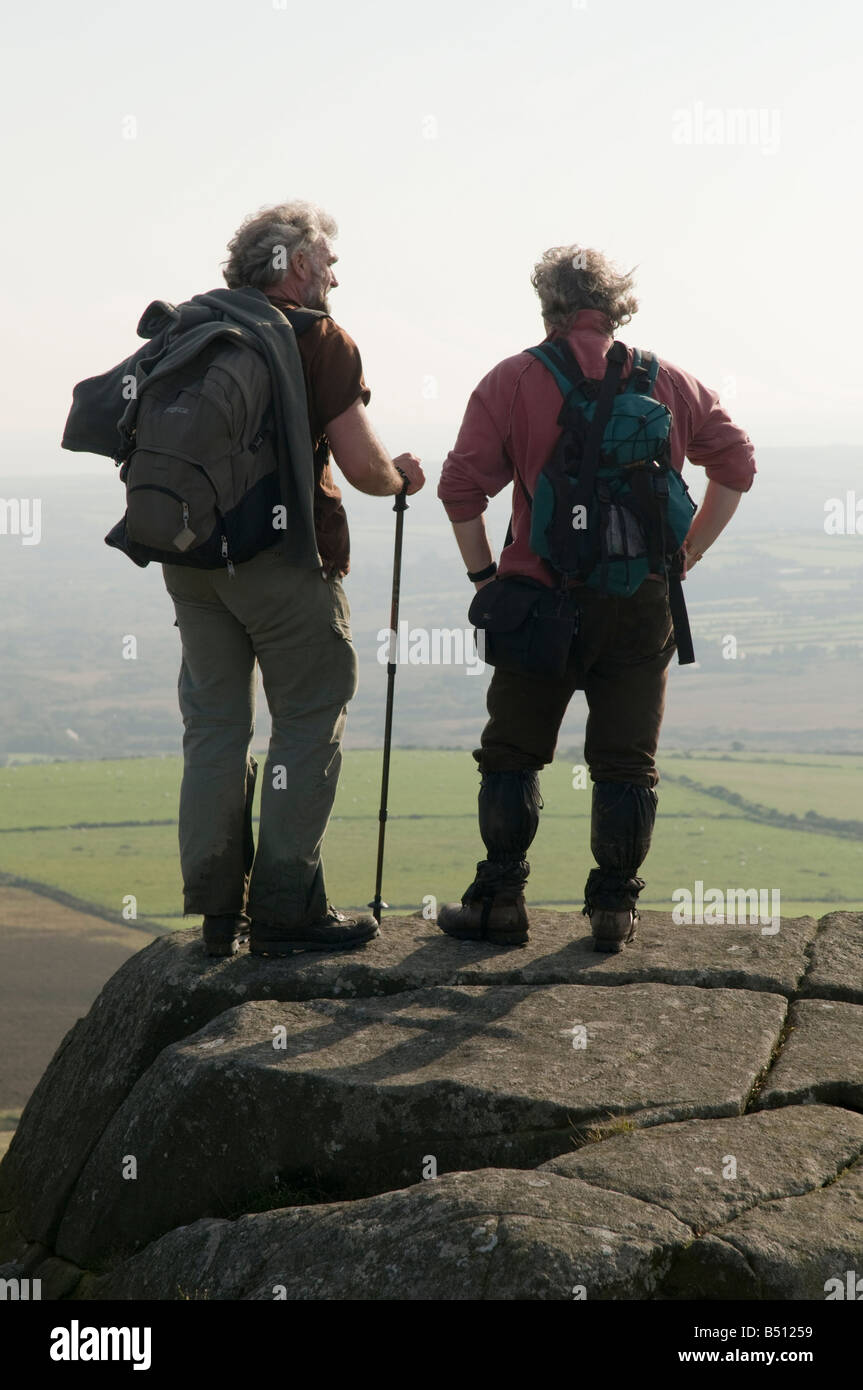 Two men hikers walkers admiring the view from Carn Menyn Carn Meini ...
